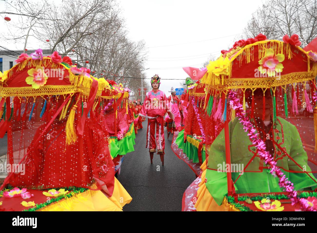 Farmers perform traditional dances during a Lunar New Year celebration ...