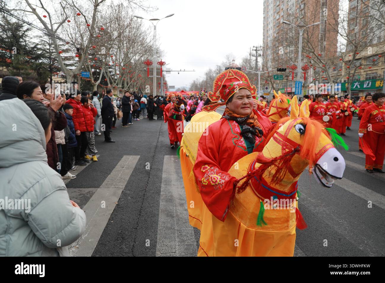 Farmers perform traditional dances during a Lunar New Year celebration ...