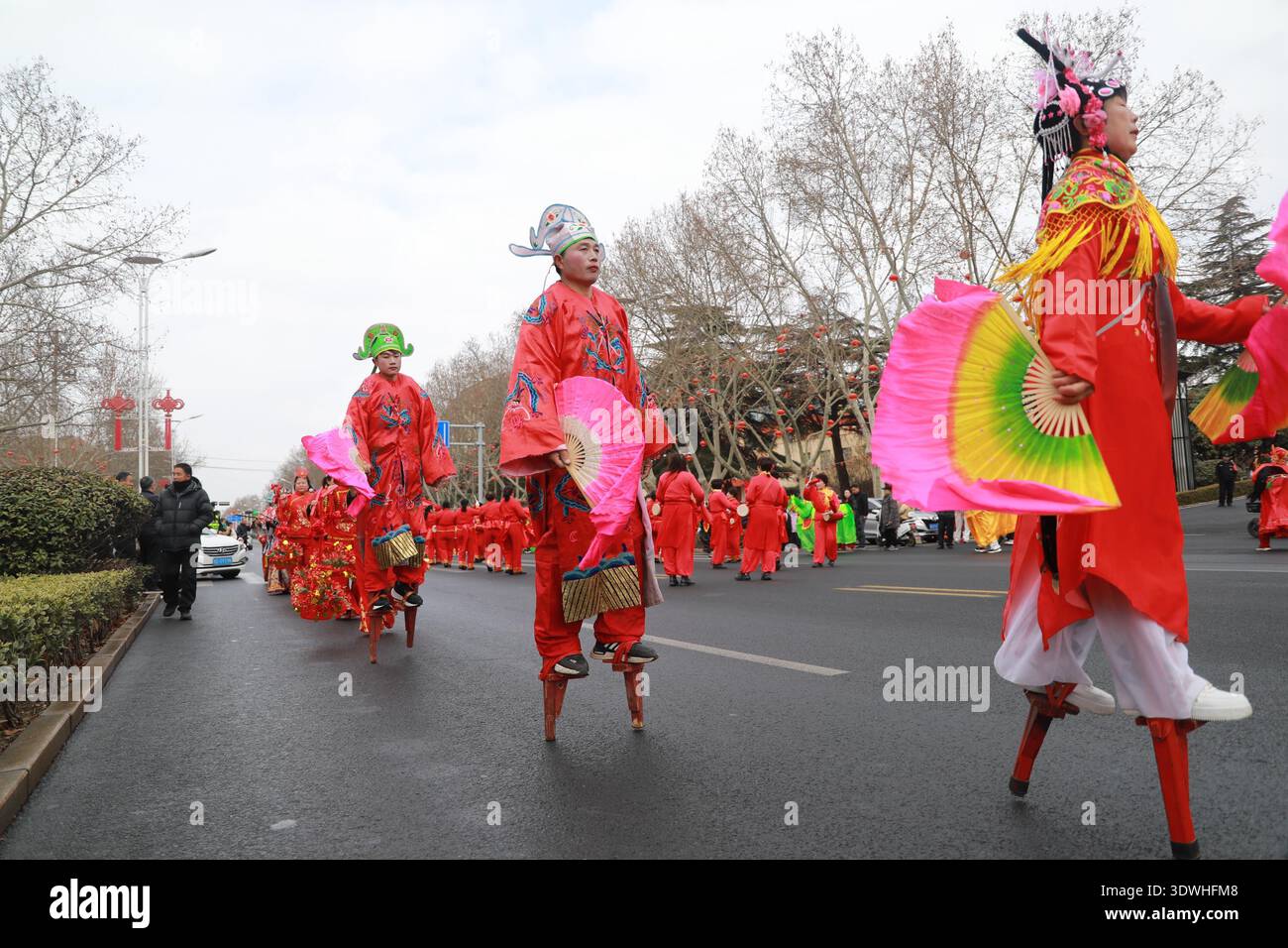 Farmers perform traditional dances during a Lunar New Year celebration ...