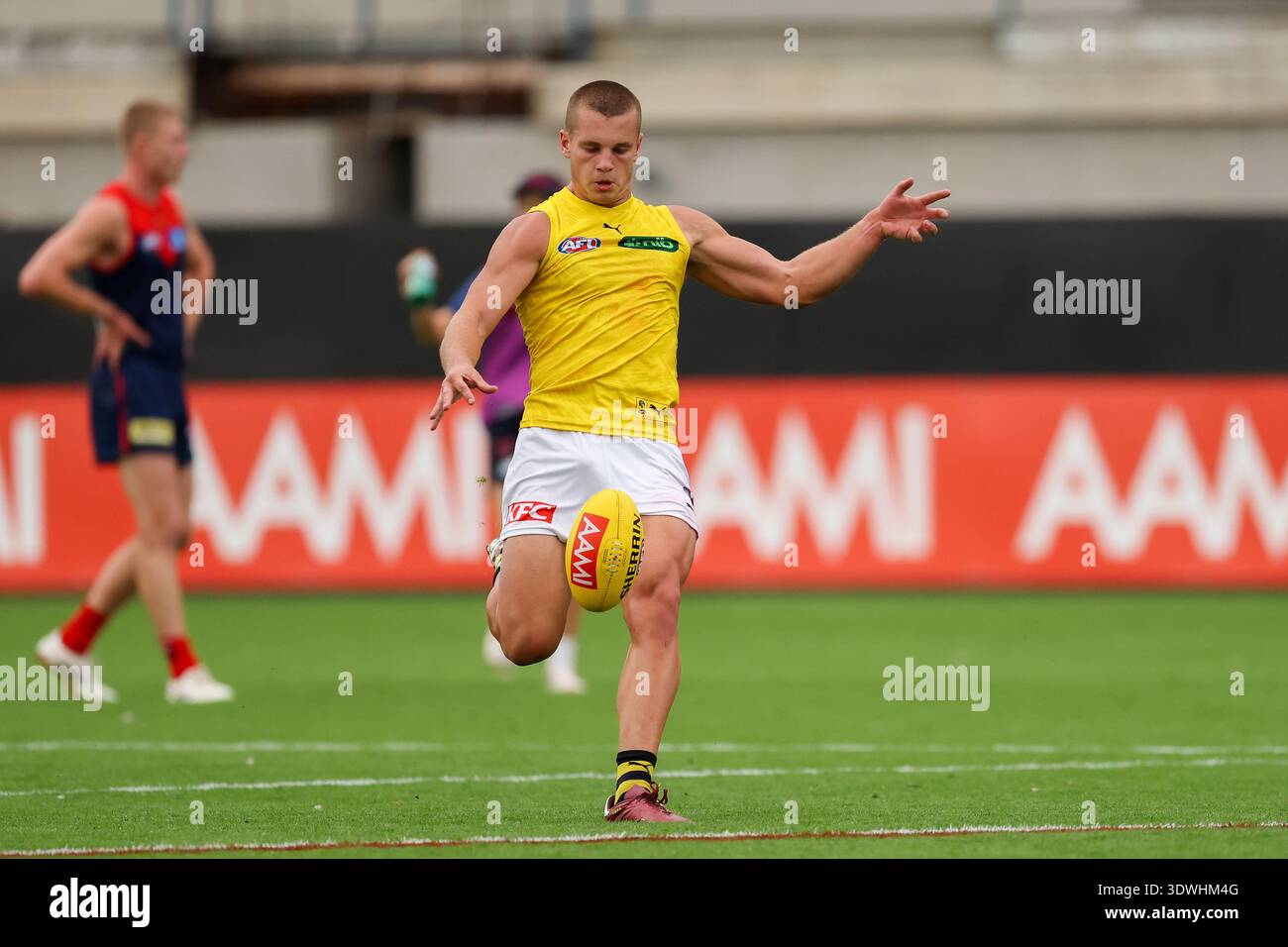 Sam Lalor of the Tigers kicks the ball during the AFL Community Series ...