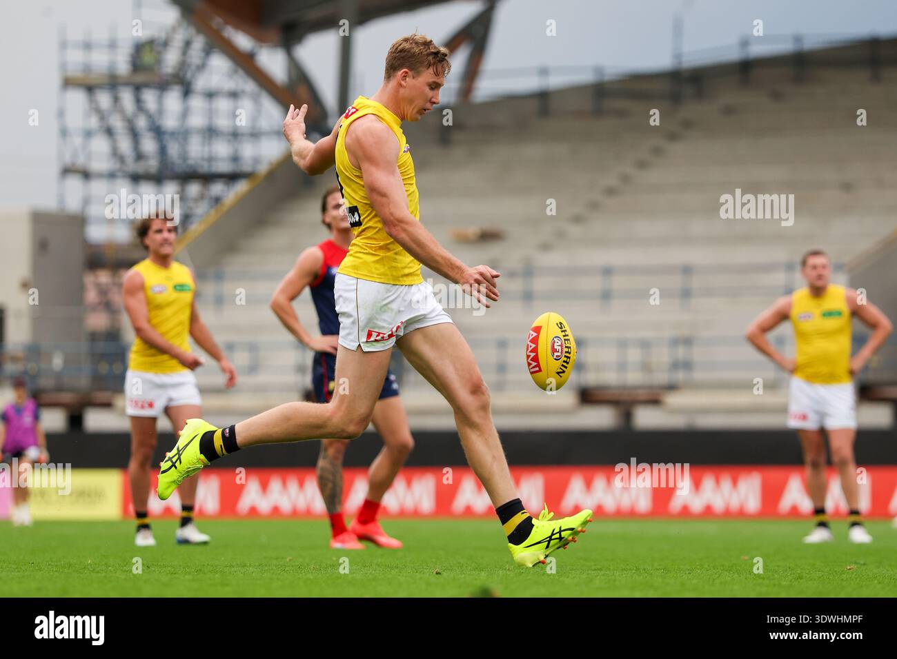 Tom Lynch of the Tigers kicks the ball during the AFL Community Series ...
