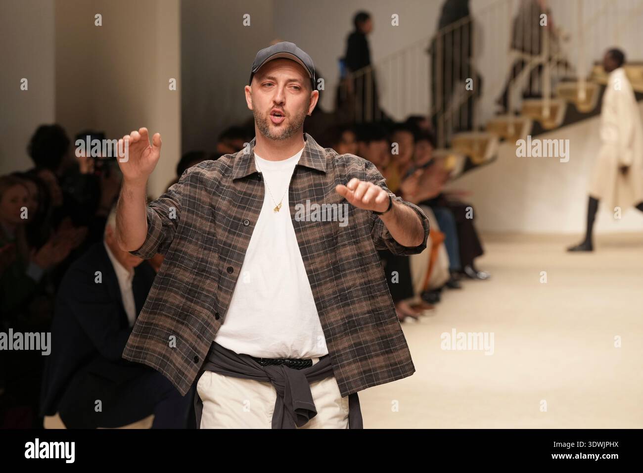 Fashion designer Matteo Tamburini thanks his guests at the end of the ...