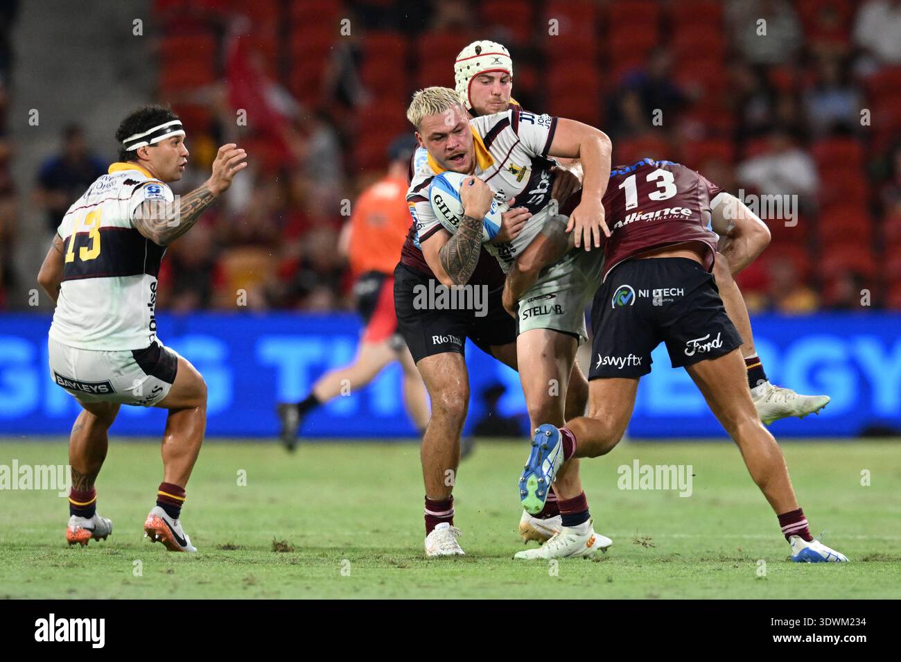 Brisbane, Australia. 27th Feb, 2026. Caleb Tangitau (centre) of the ...