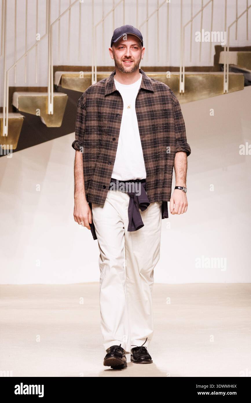 Fashion designer Matteo Tamburini walks the runway at the Tod's fashion ...