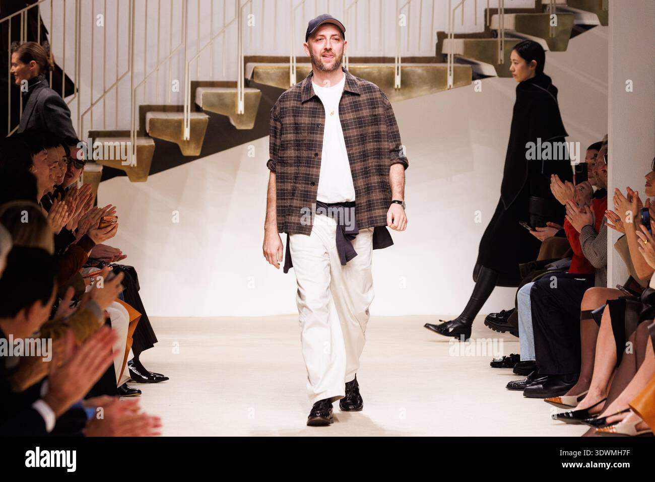 Fashion designer Matteo Tamburini walks the runway at the Tod's fashion ...