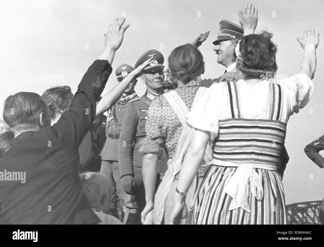 Volksdeutsche greet Adolf Hitler with the Nazi salute. General Erwin ...
