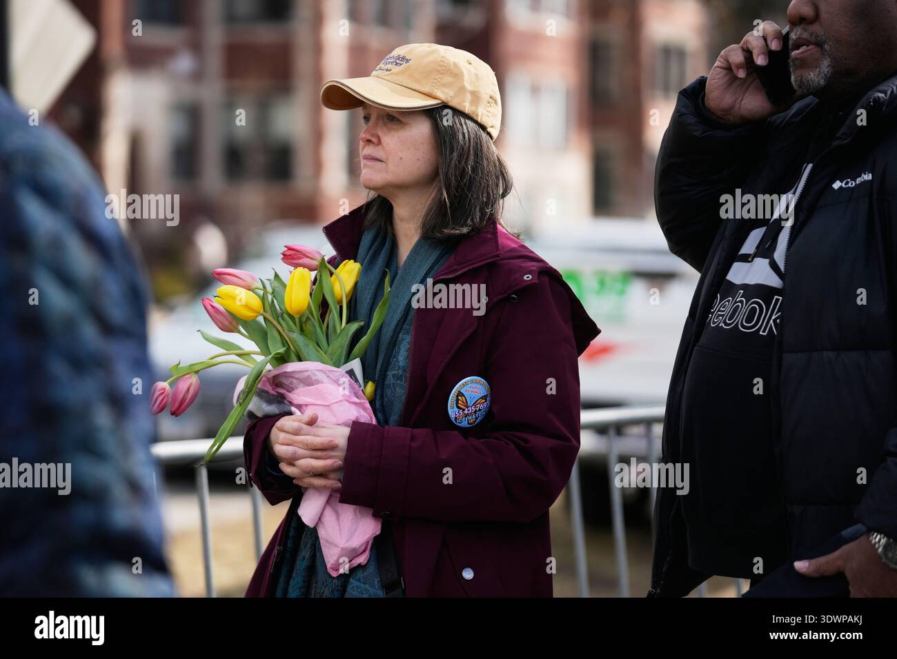 Sara West waits in line to attend a public visitation for the Rev ...