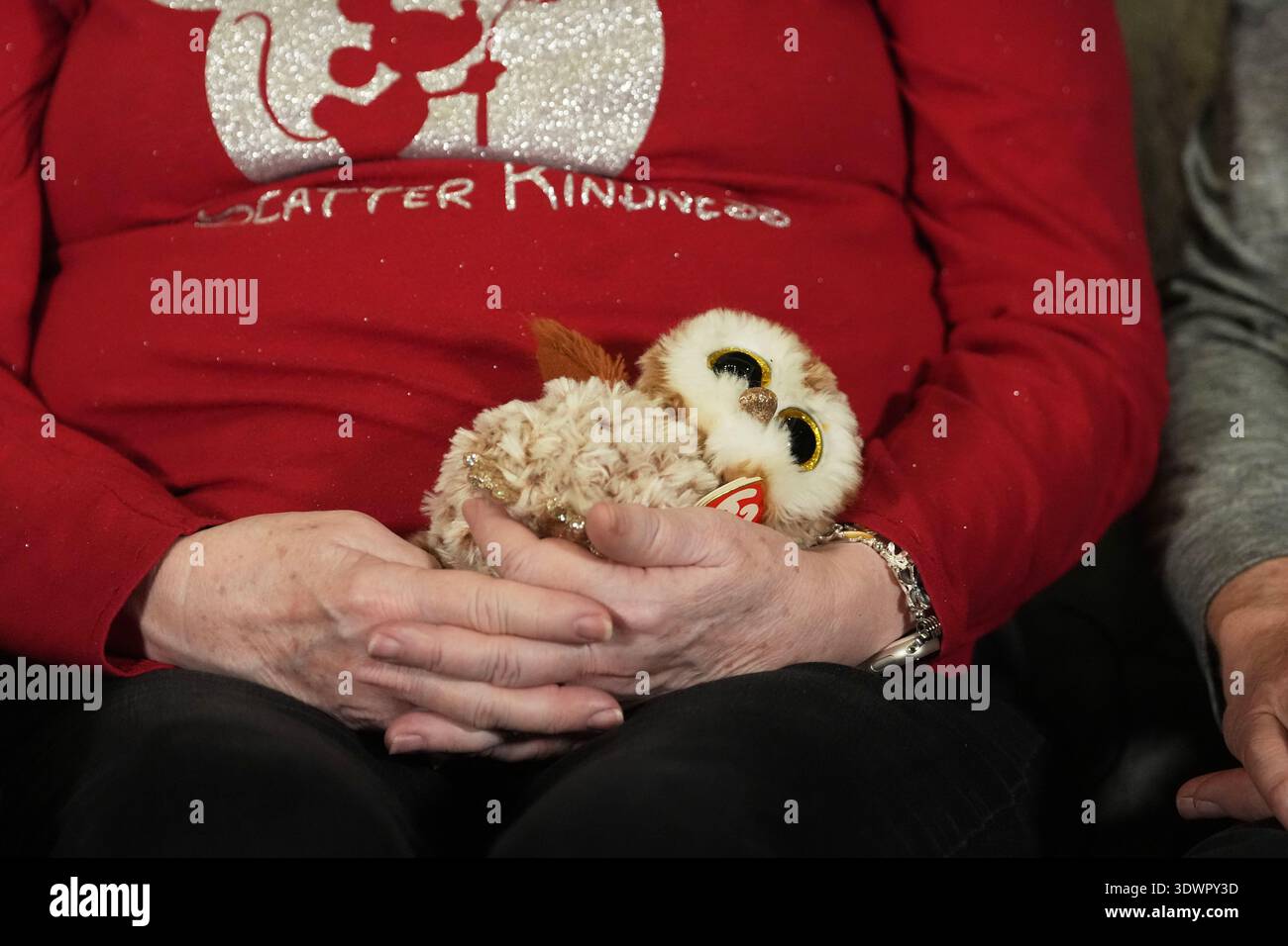 Donna Ganger, mother of Renee Good, holds a stuffed owl that her ...