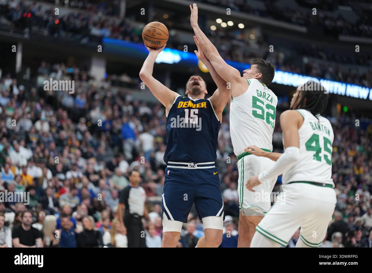 Denver Nuggets center Nikola Jokić (15) goes up for basket as Boston ...