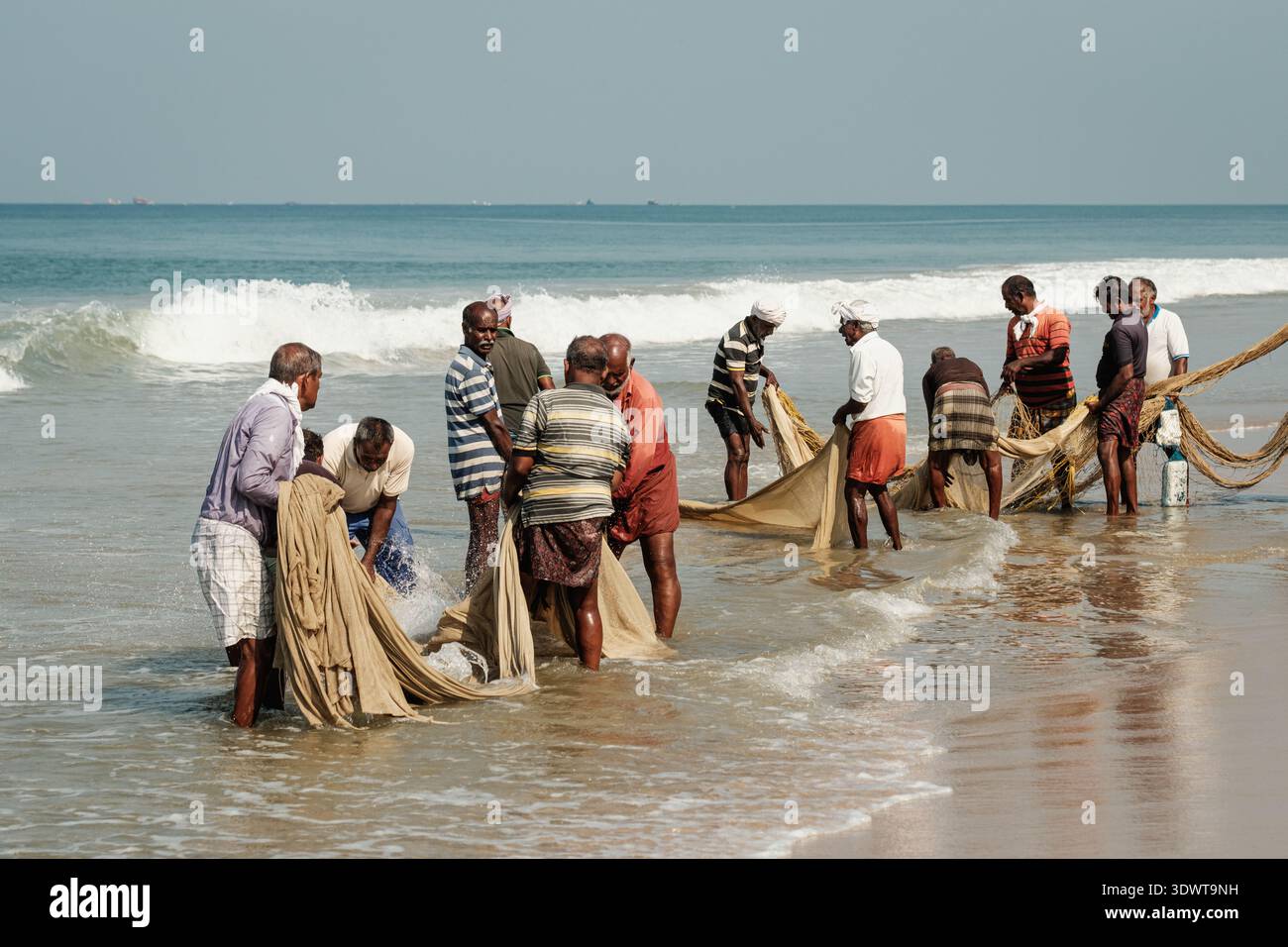 Group local fishermen pulling heavy hi-res stock photography and images ...