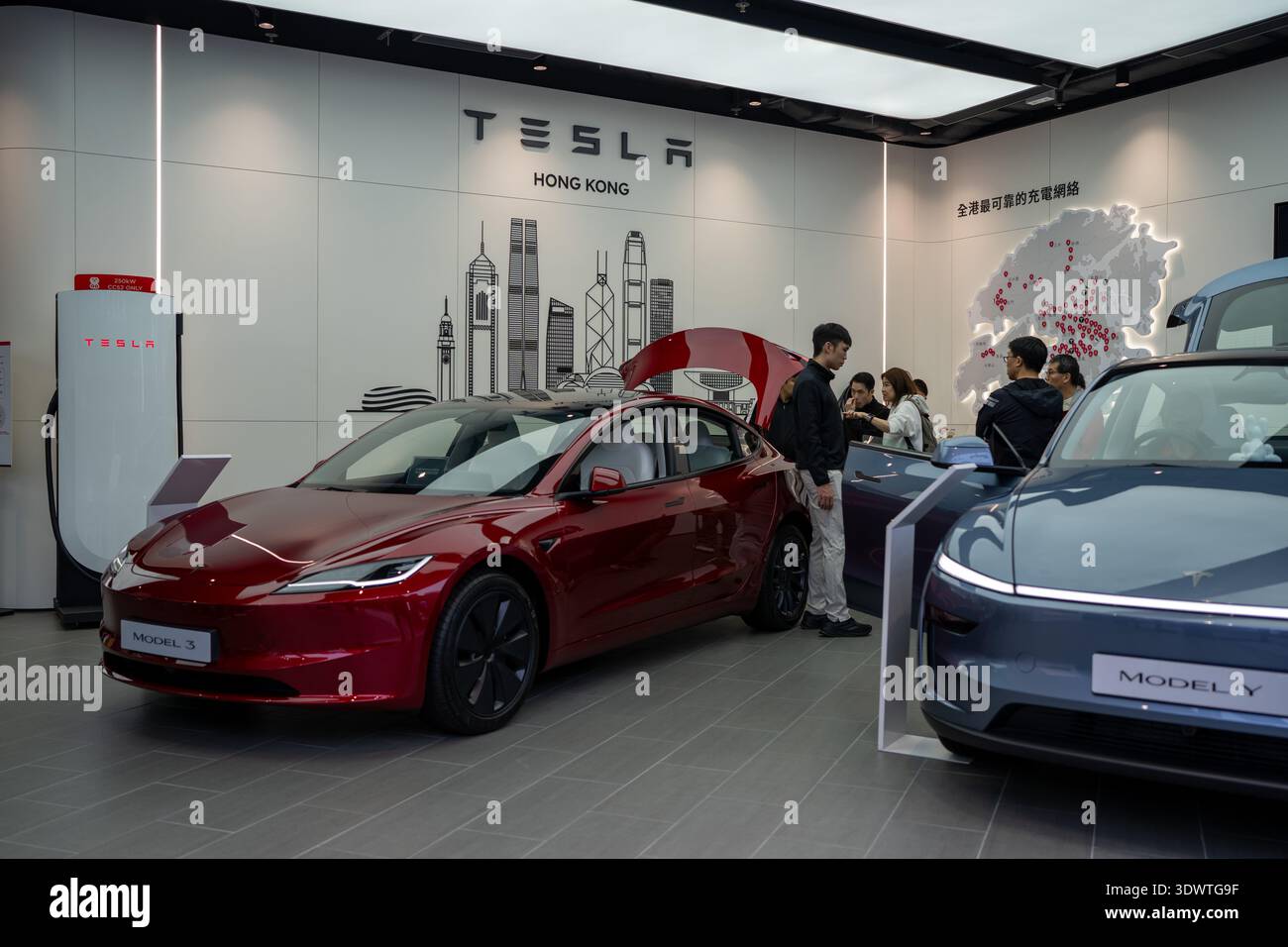 A Tesla Model 3 and Model Y in a Tesla showroom in Hong Kong, February ...