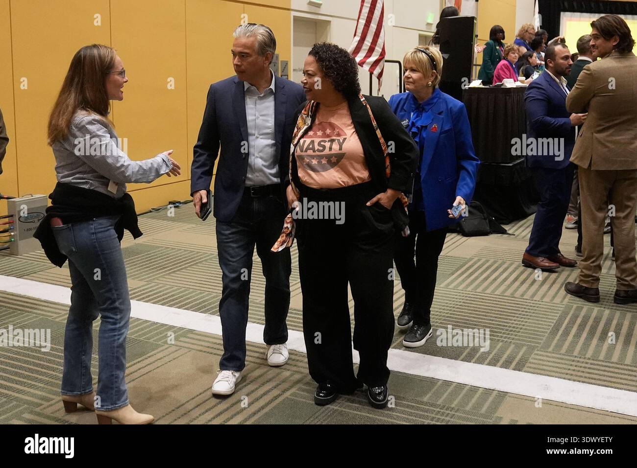California Attorney General Rob Bonta, middle left, and his wife, Mia ...