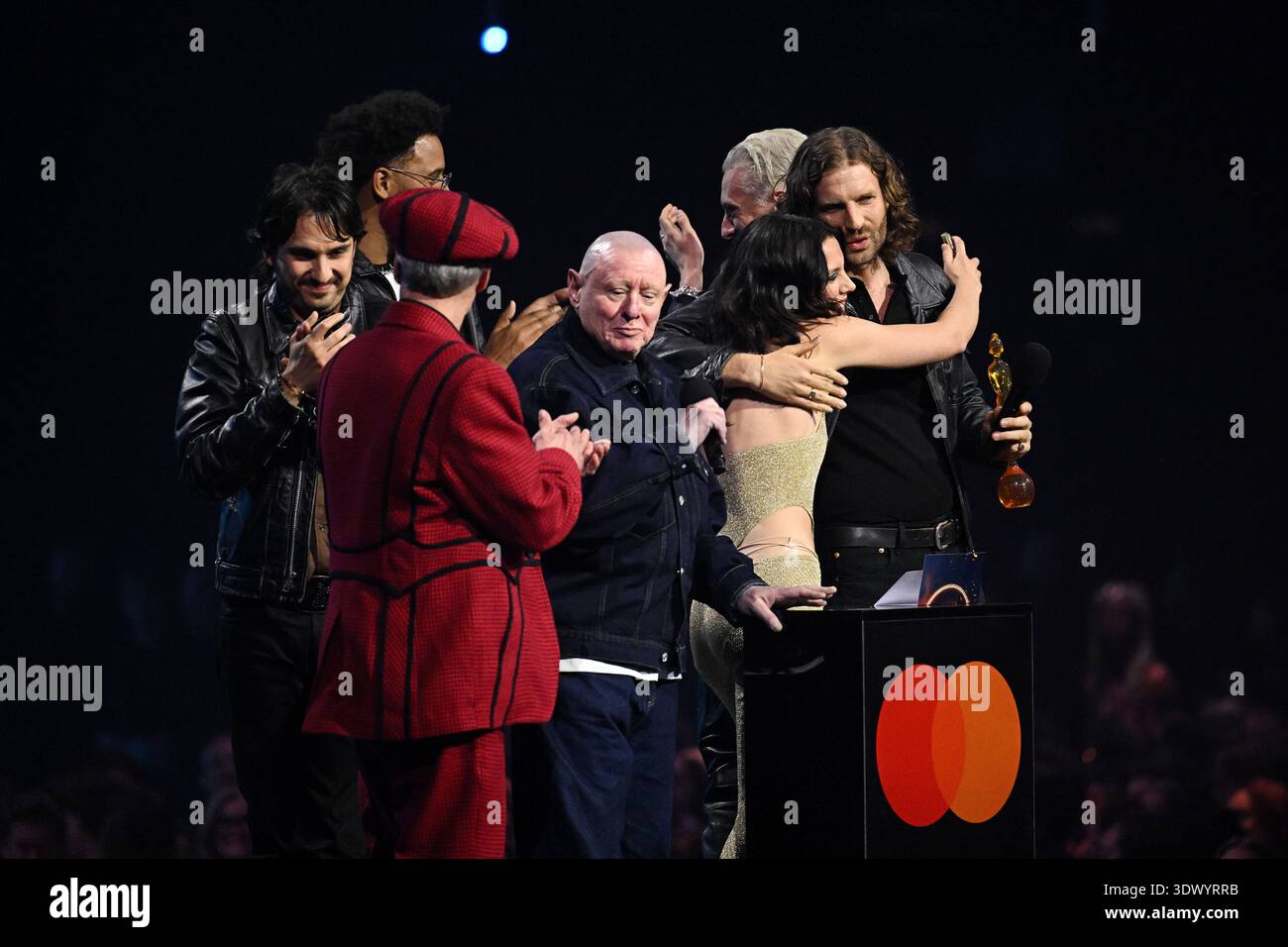 Wolf Alice accept the award for group of the year from Shaun Ryder and ...