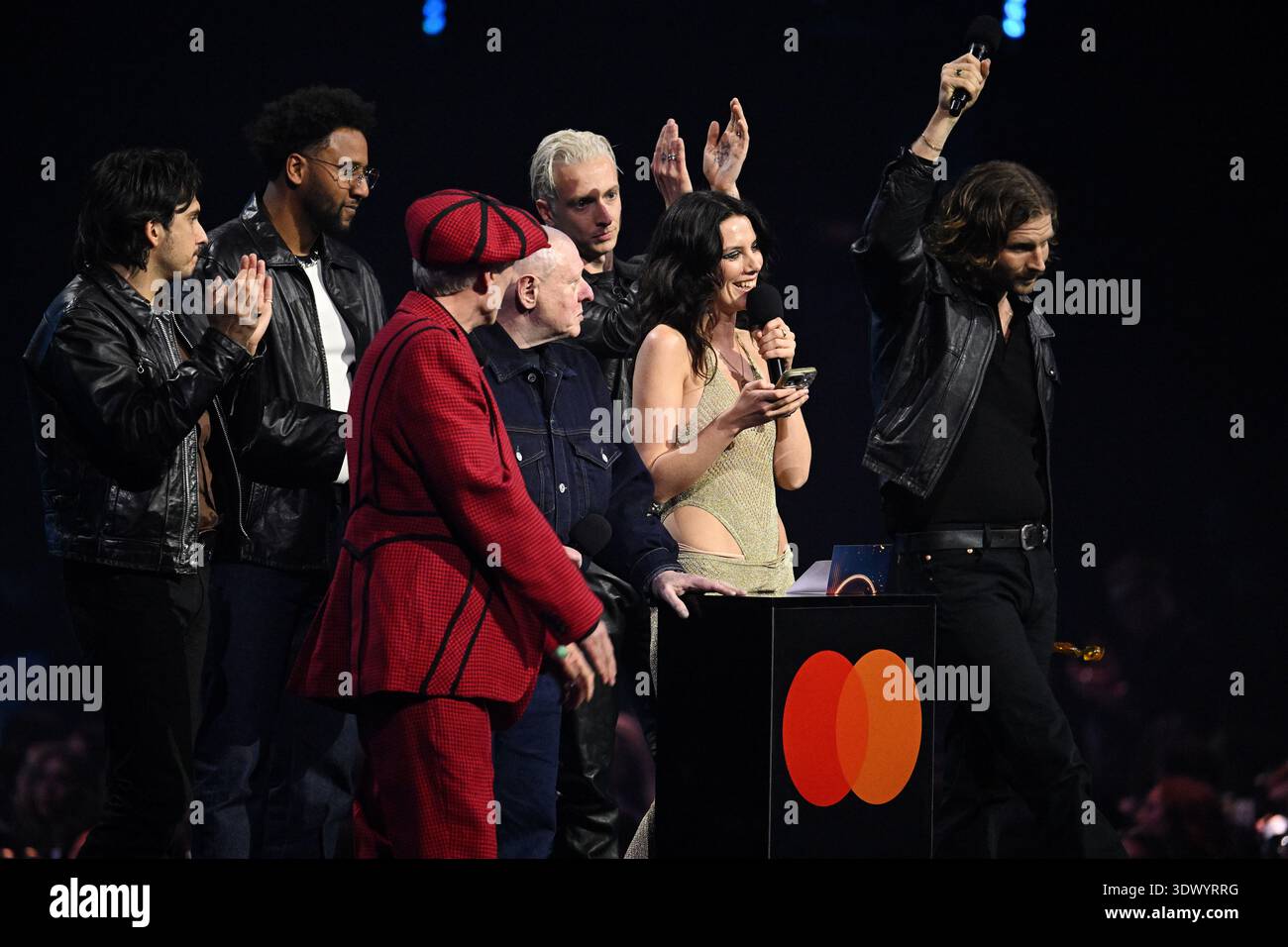 Wolf Alice accept the award for group of the year from Shaun Ryder and ...