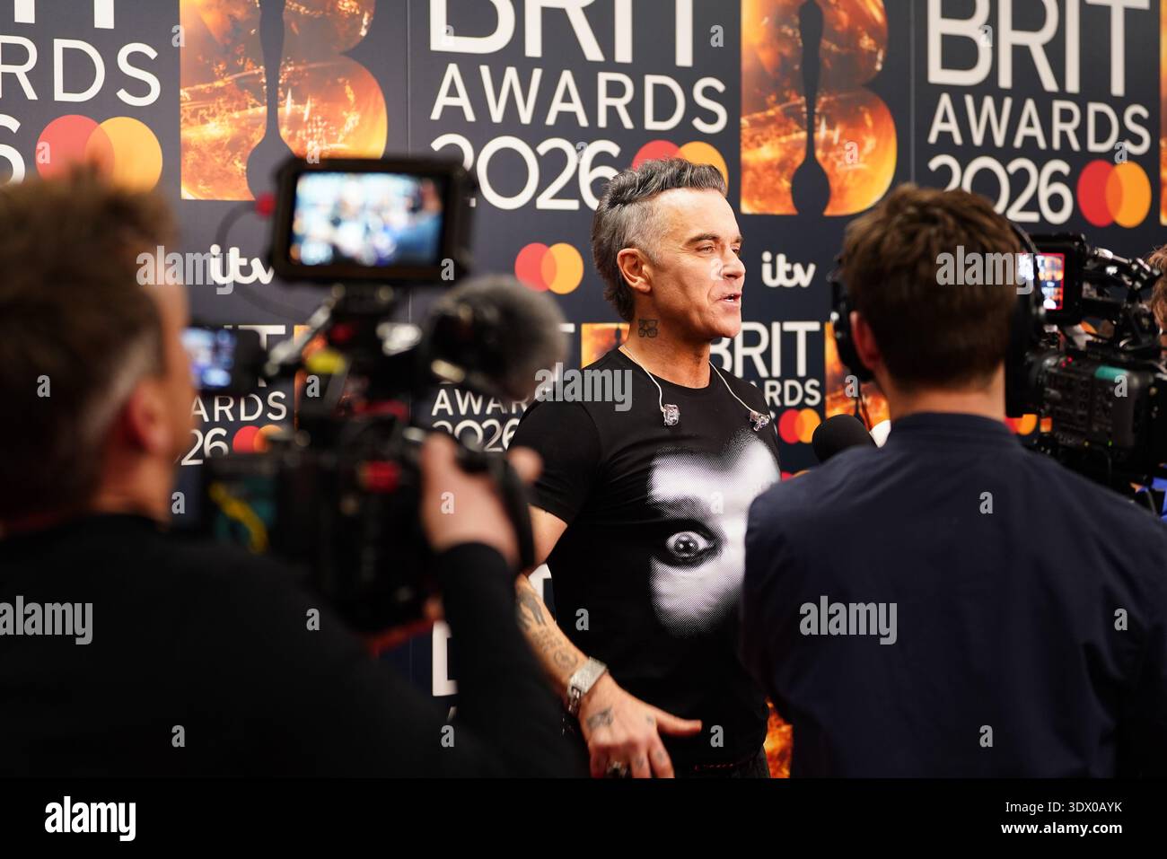 Robbie Williams backstage during the Brit Awards 2026 at Co-op Live ...