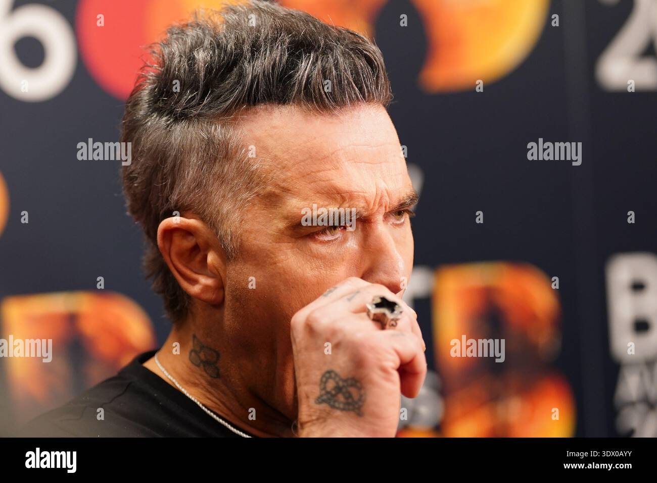 Robbie Williams backstage during the Brit Awards 2026 at Co-op Live ...