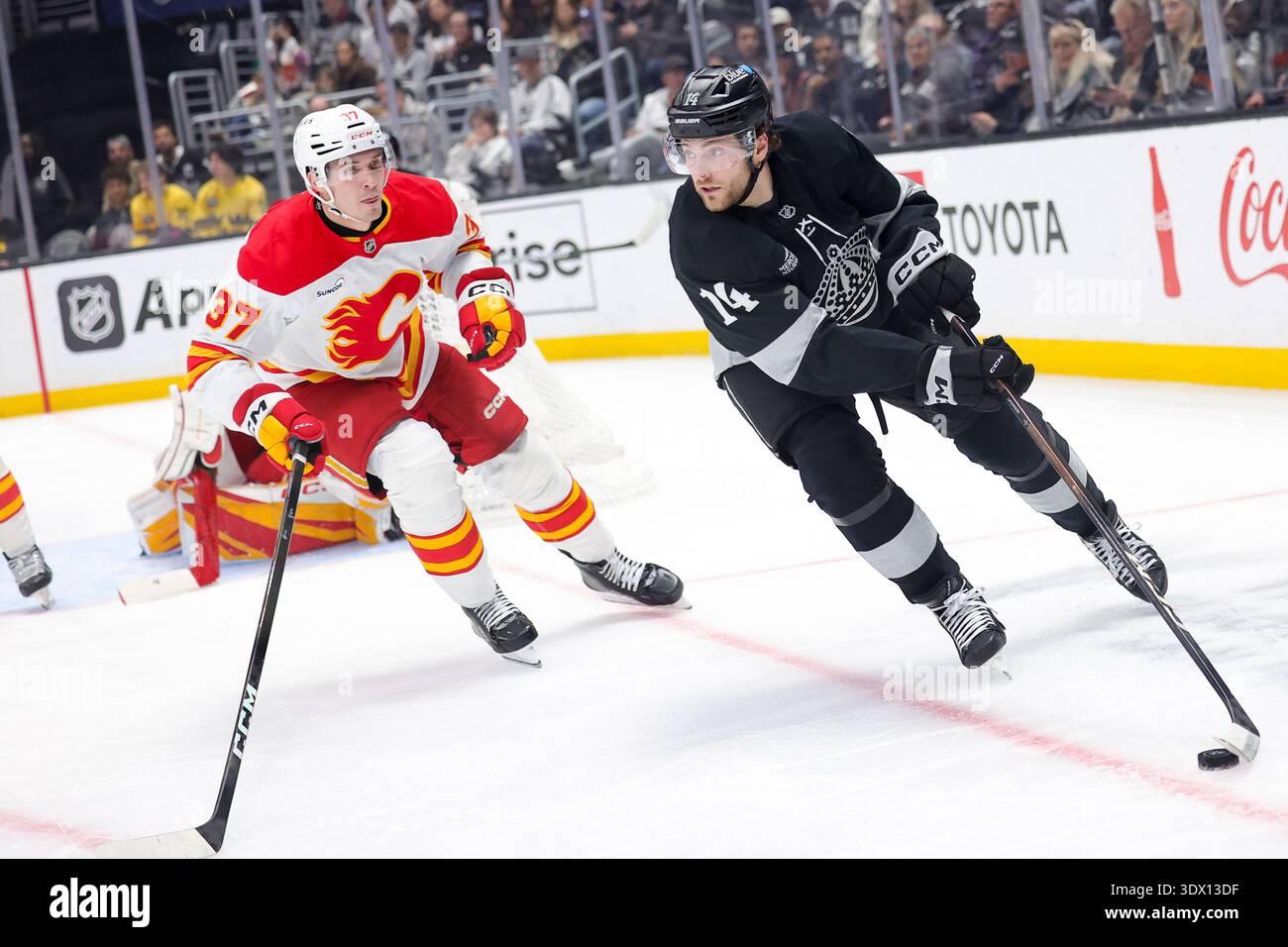Los Angeles Kings right wing Alex Laferriere, right, moves the puck ...