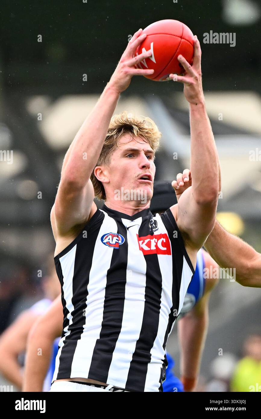 Edward Allan of the Magpies in action during the AFL Community Series ...