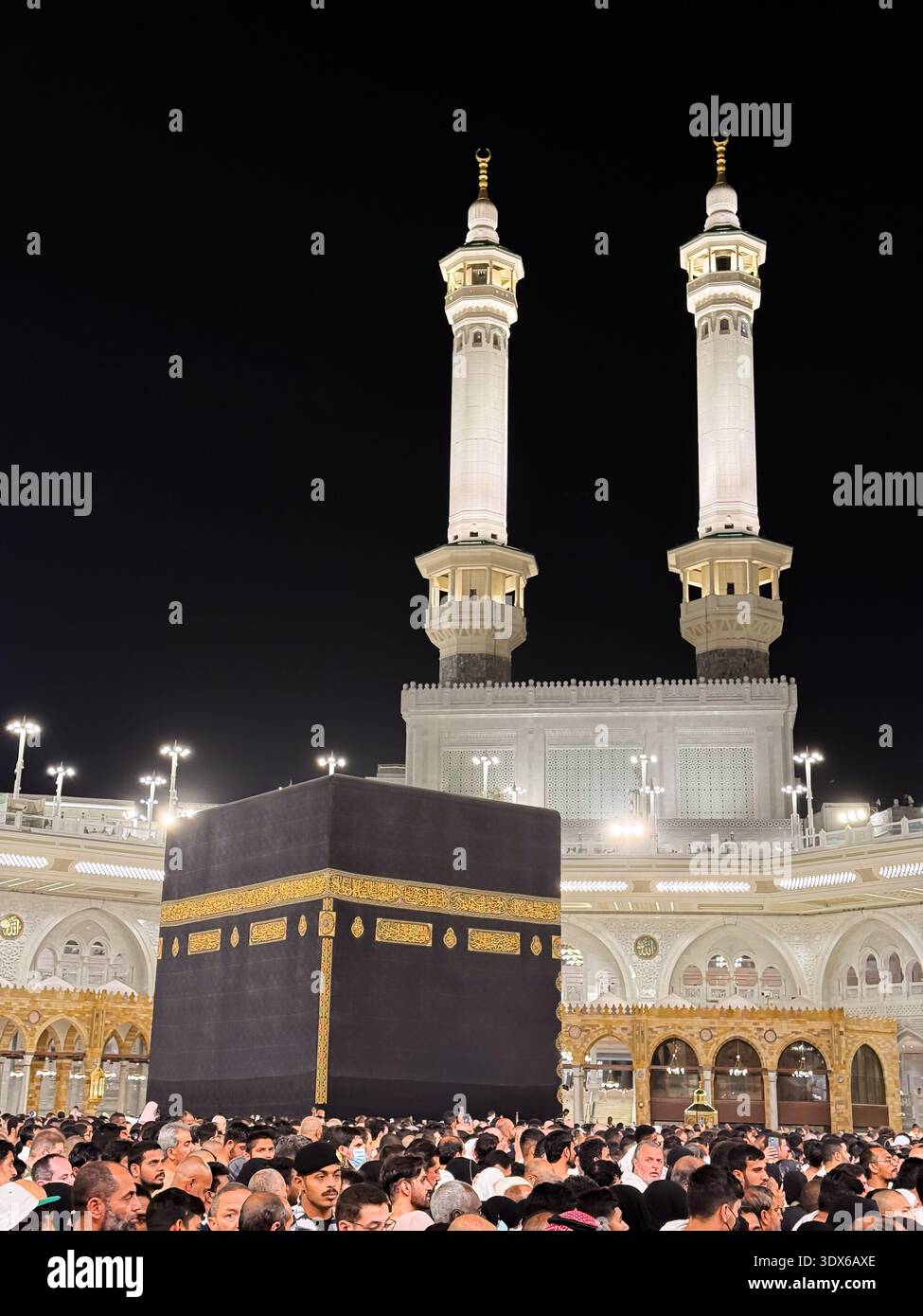 Pilgrims circling the Kaaba at Masjid al-Haram in Mecca during night ...