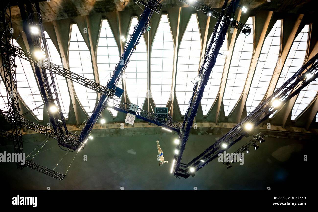 Canadian high diver Michael Foisy jumps off the catwalk of the Olympic ...
