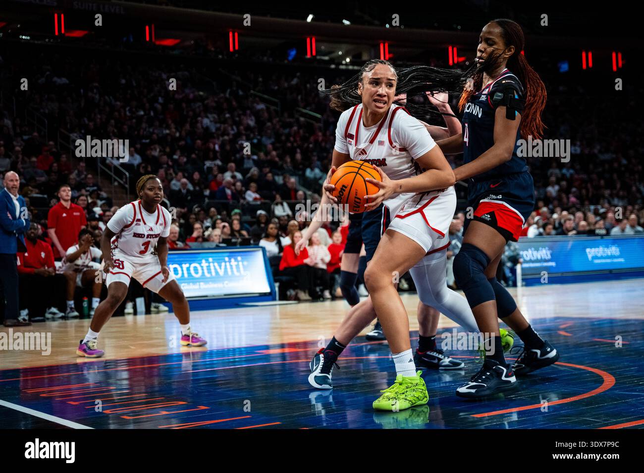 St. John's forward Daniela Abies searches for a pass during the first ...