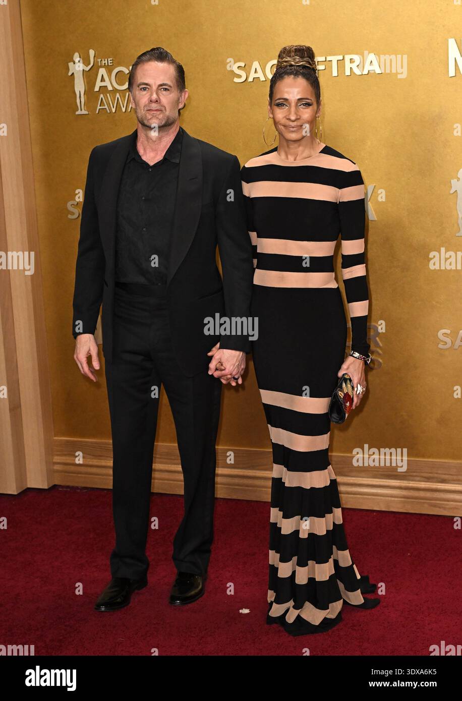 Gil Dillahunt and Michelle Hurd arriving at the 32nd Annual Actor ...