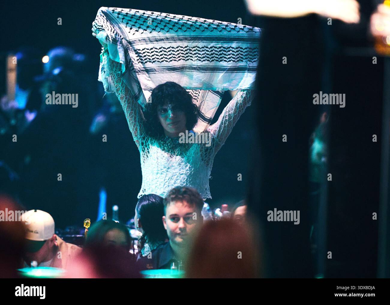 Jacob Alon holds a keffiyeh during the Brit Awards 2026 in Manchester ...
