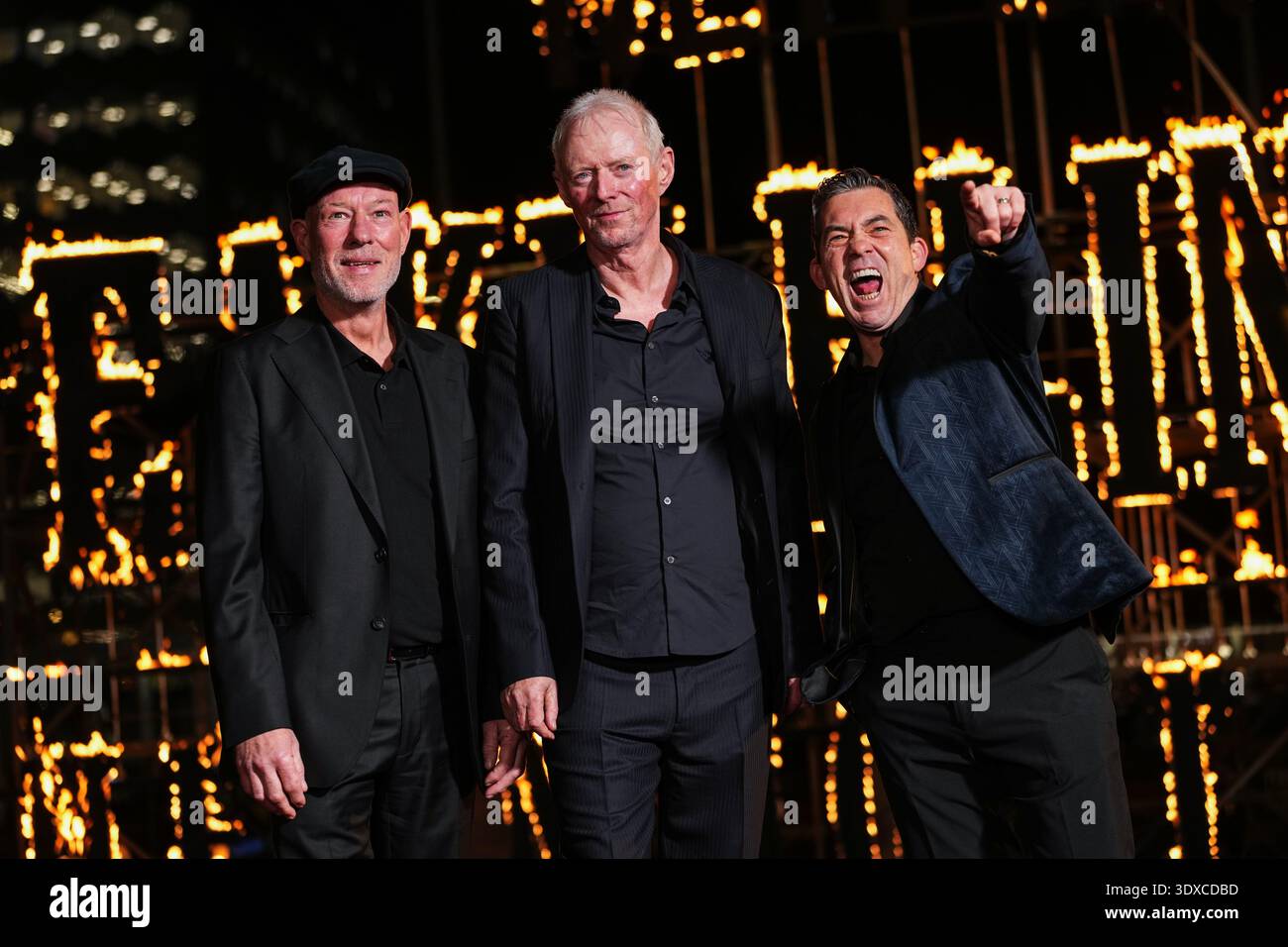 Ian Peck, from left, Ned Dennehy, and Packy Lee pose for photographers ...