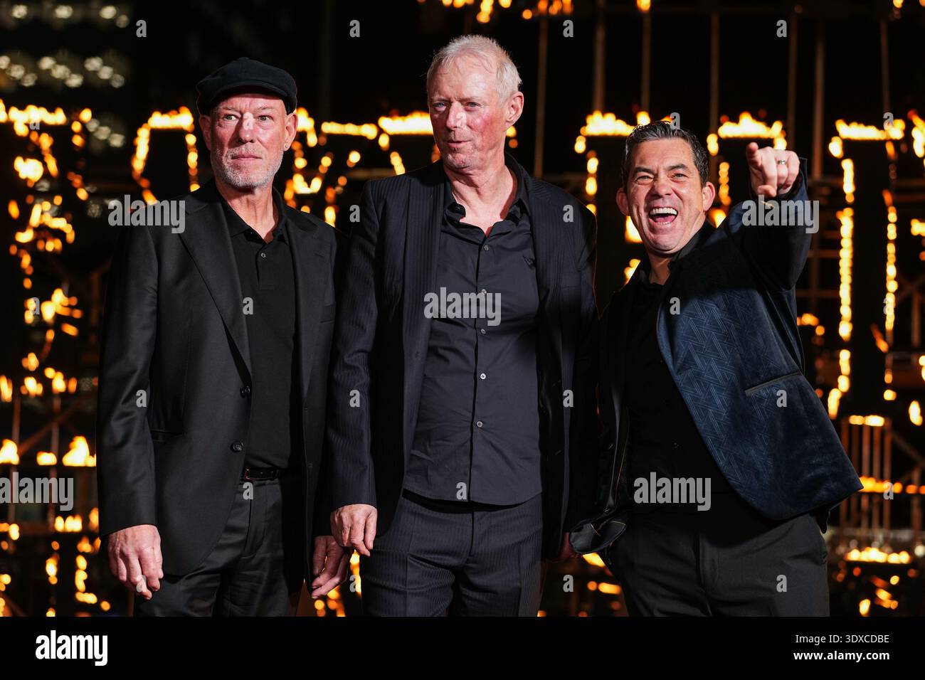Ian Peck, from left, Ned Dennehy, and Packy Lee pose for photographers ...