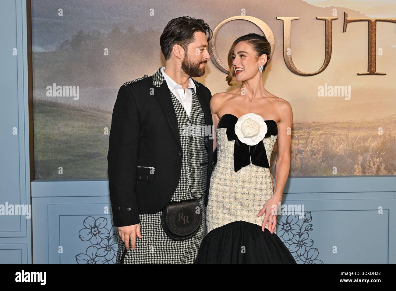 Richard Rankin, left, and Sophie Skelton attend the STARZ premiere of ...