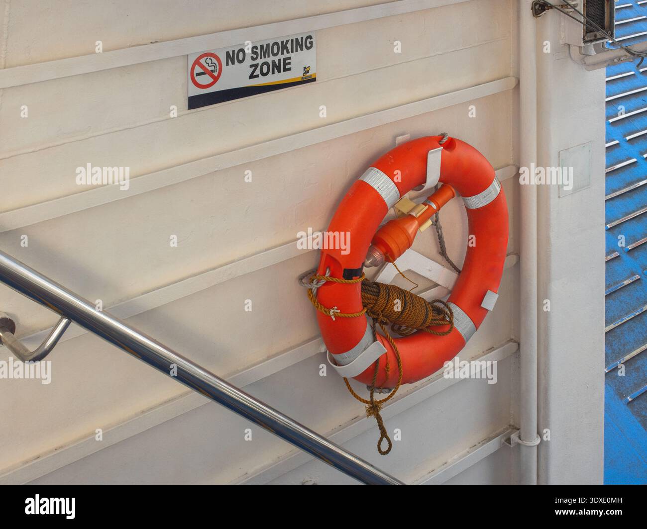 Safety Equipment on Ship Deck: Orange Lifebuoy and No Smoking Zone Sign ...
