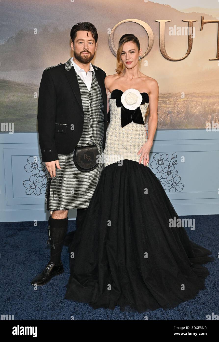Richard Rankin, left, and Sophie Skelton attend the STARZ premiere of ...