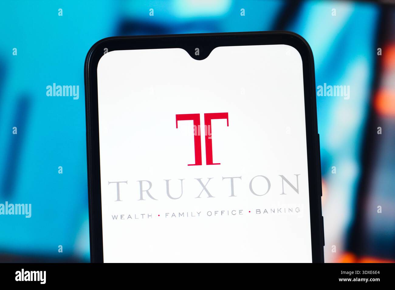 In this photo illustration, the Truxton Corp. logo is seen displayed on ...