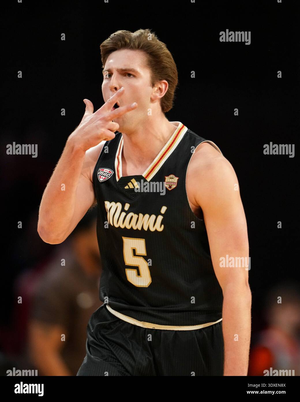 Miami (Ohio) guard Peter Suder (5) reacts after scoring during an NCAA ...