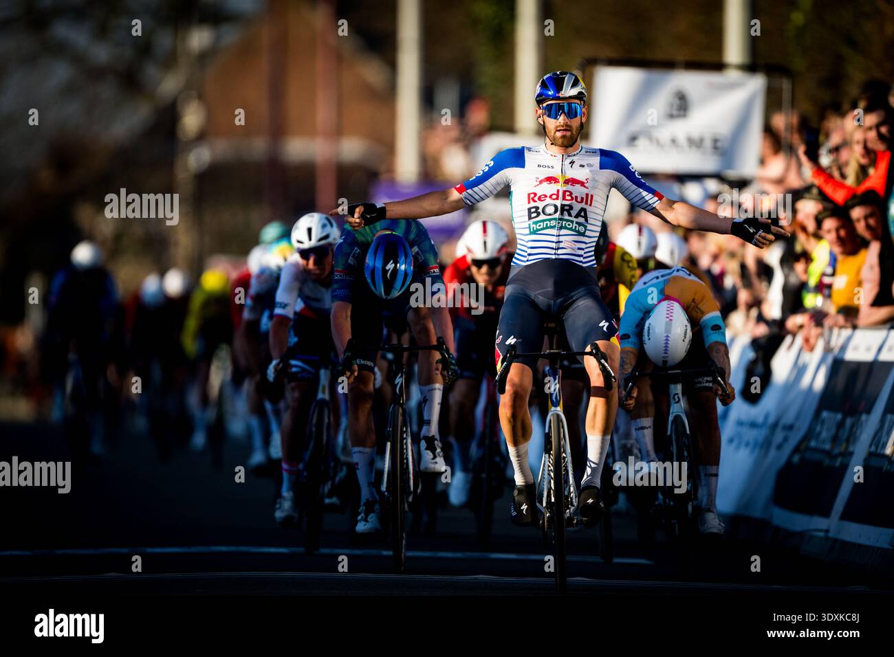 Belgian Jordi Meeus of Red Bull-BORA-hansgrohe celebrates as he crosses ...