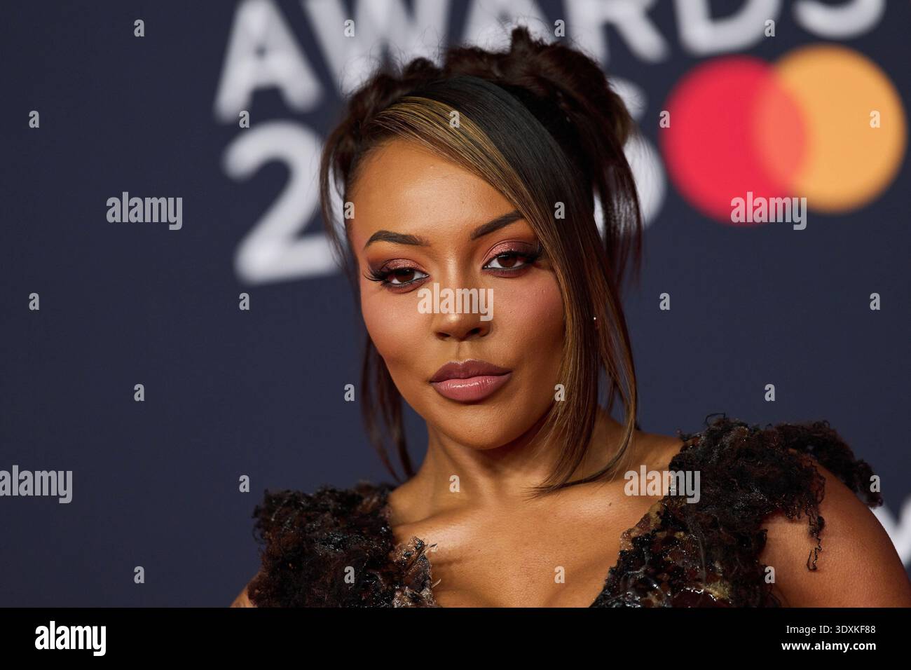 Ash Holme poses for photographers upon arrivals during the Brit Awards ...