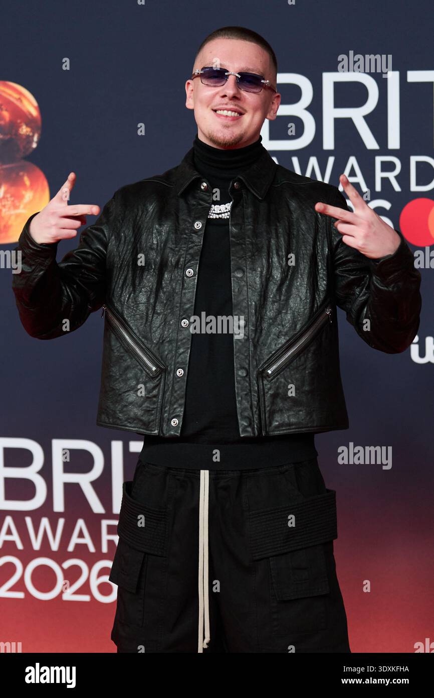 Aitch poses for photographers upon arrivals during the Brit Awards 2026 ...