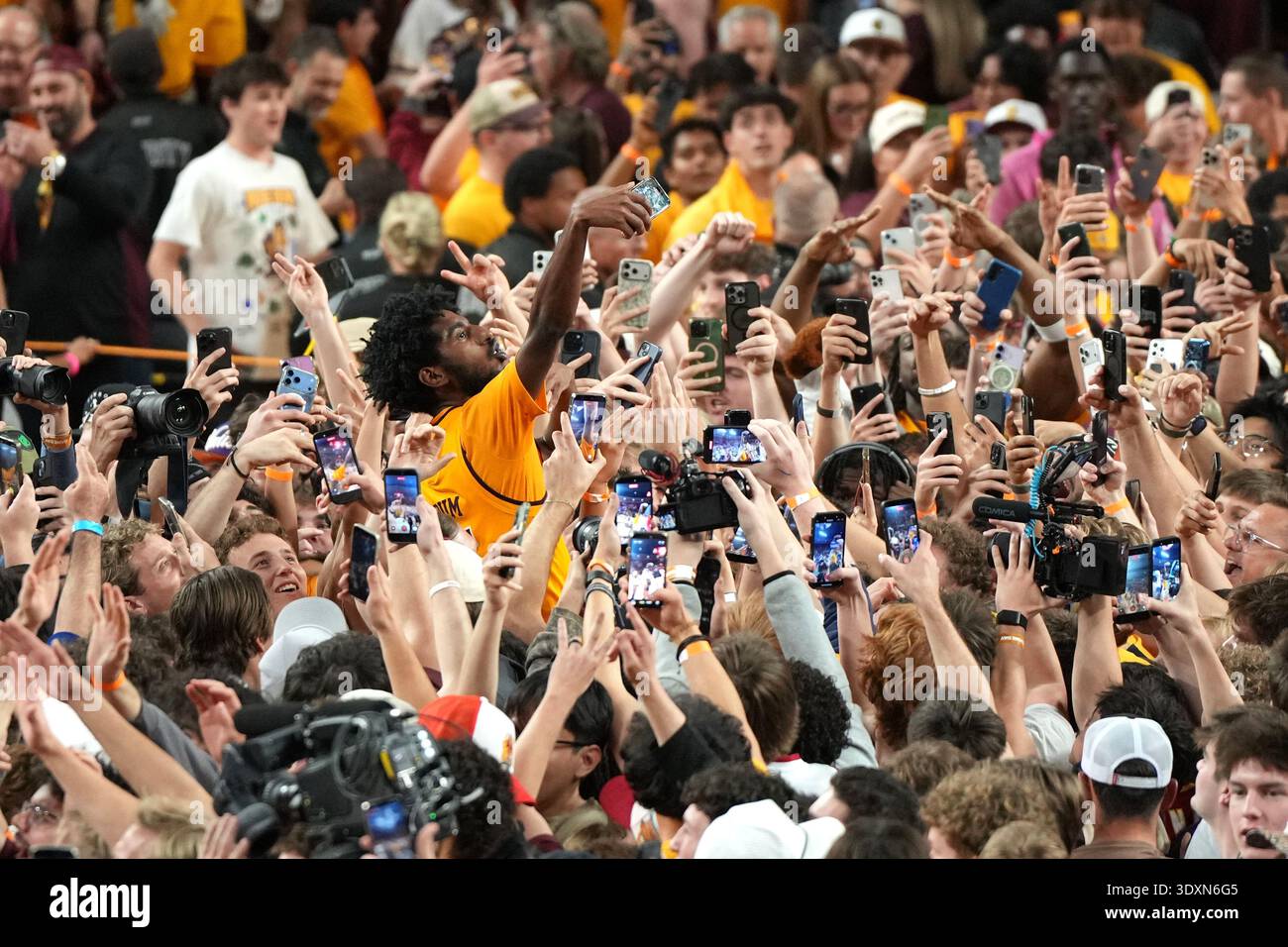 Arizona State guard Maurice Odum celebrates with fans after defeating ...