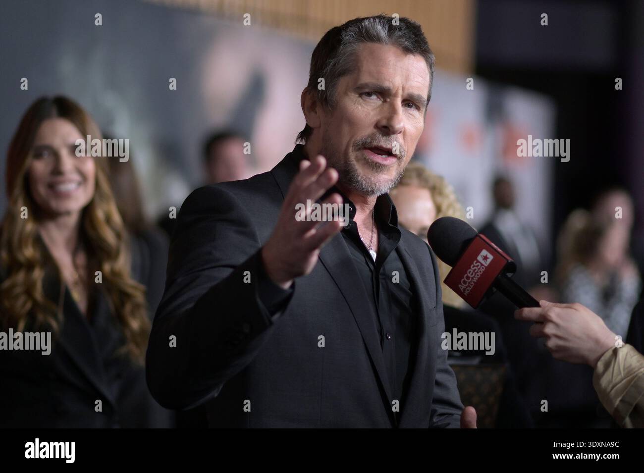 Christian Bale walking the red carpet at the US Premiere of 'The Bride ...