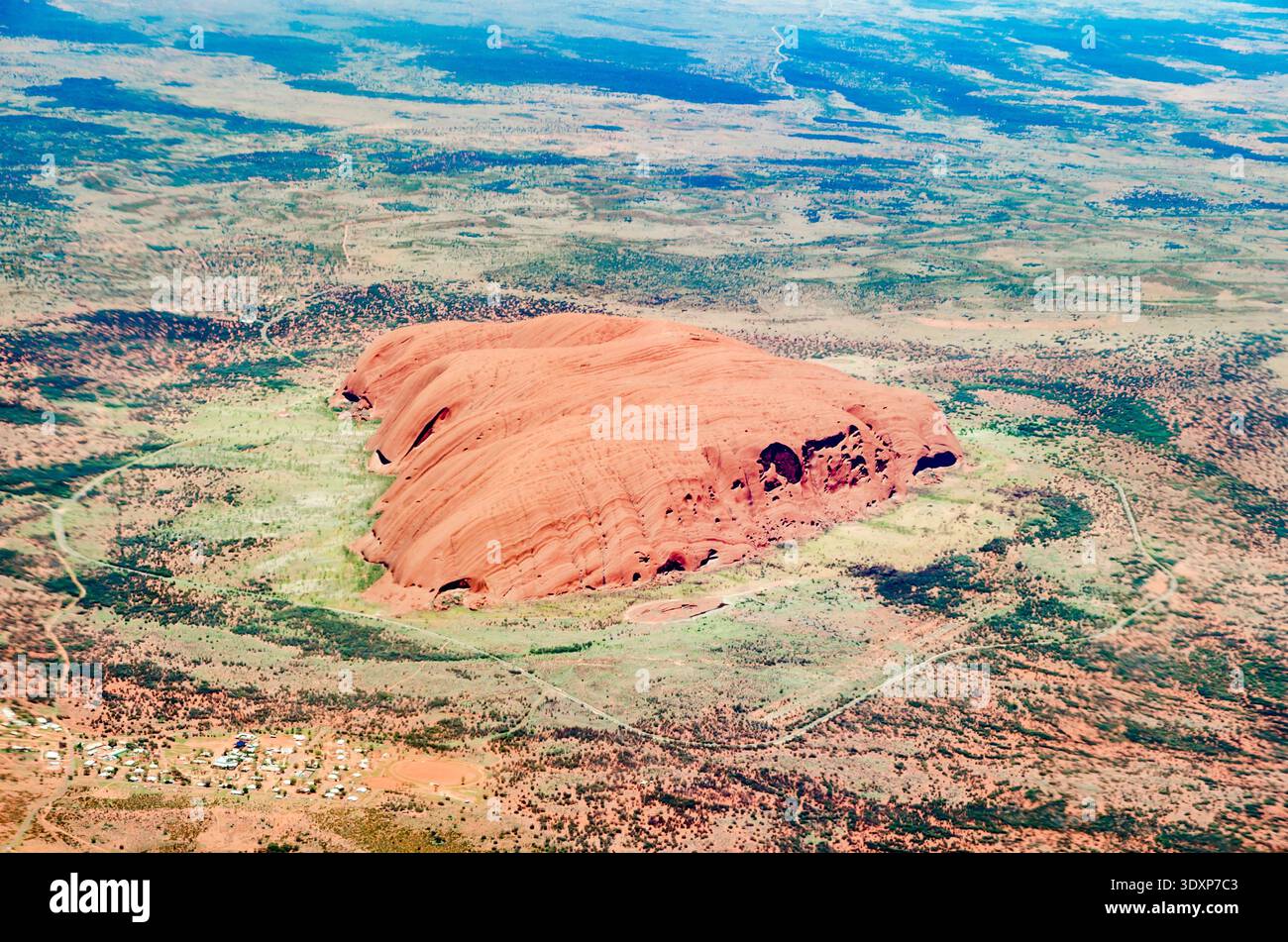 Aerial view of Uluru (Ayers Rock), a massive sandstone monolith located ...