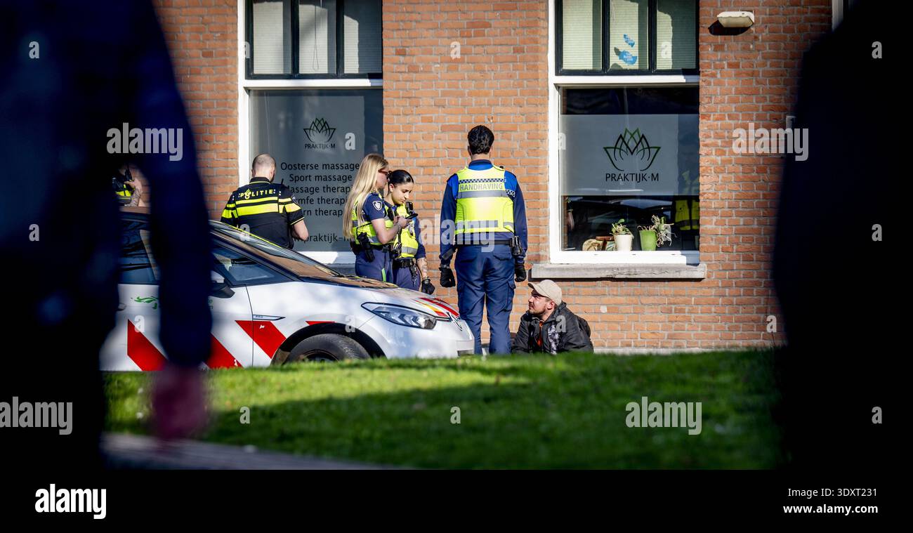 ROTTERDAM - Police officers and enforcement officers at work on the ...