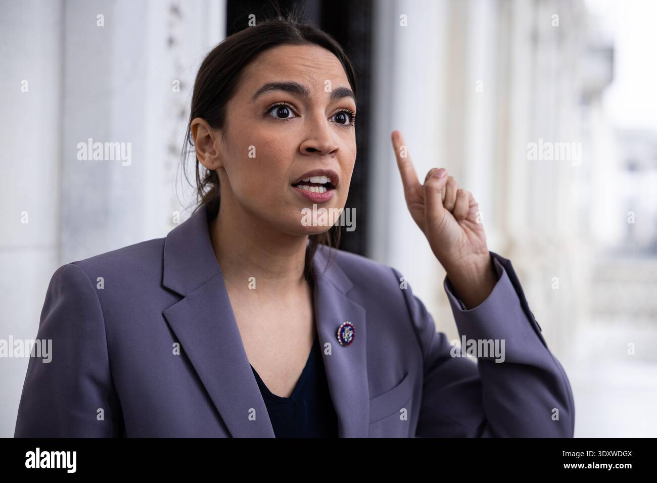 Rep. Alexandria Ocasio-Cortez (D-N.Y.) speaks with reporters as she ...