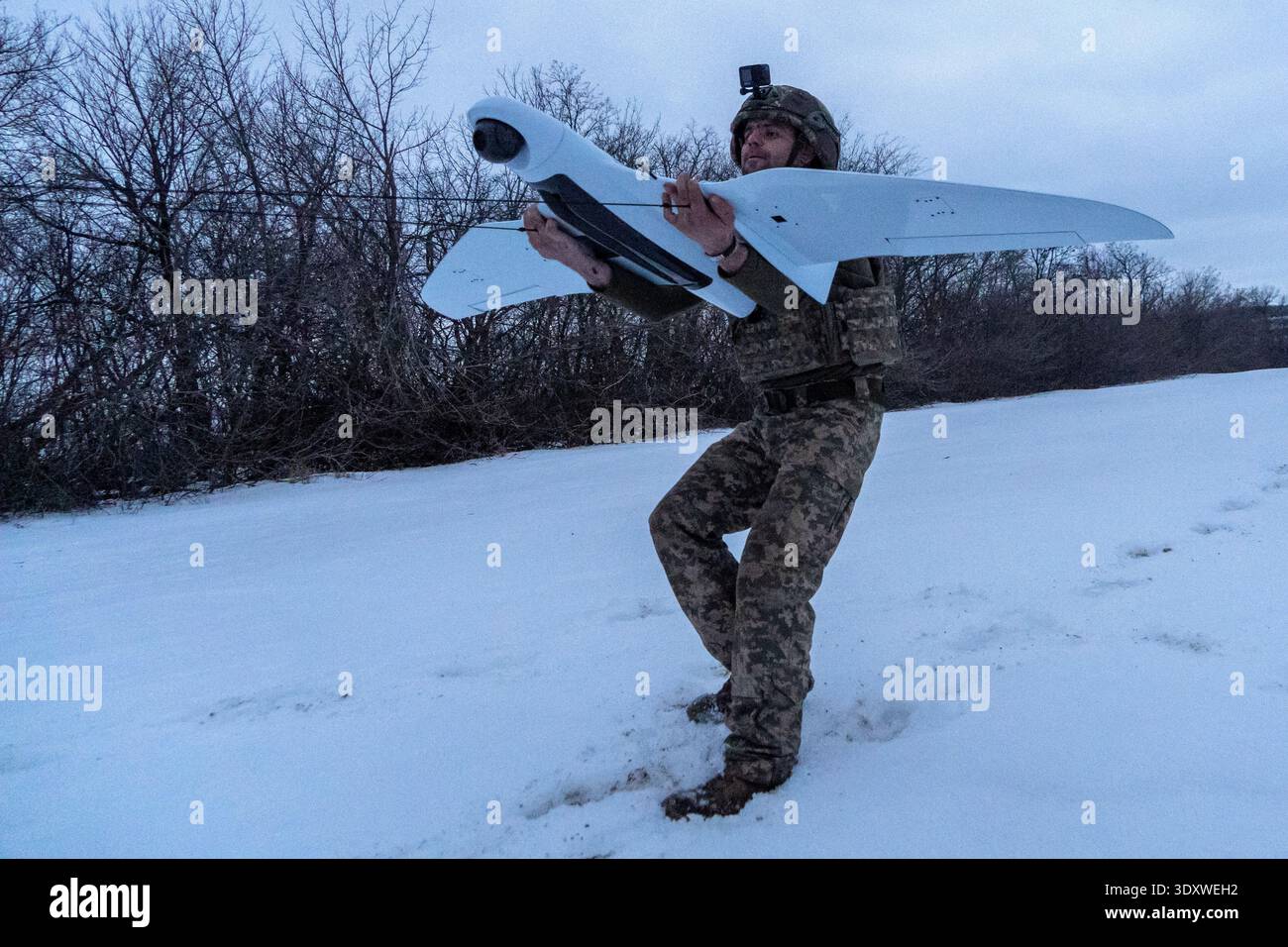 A Ukrainian soldier of the 48th separate brigade launches a ...