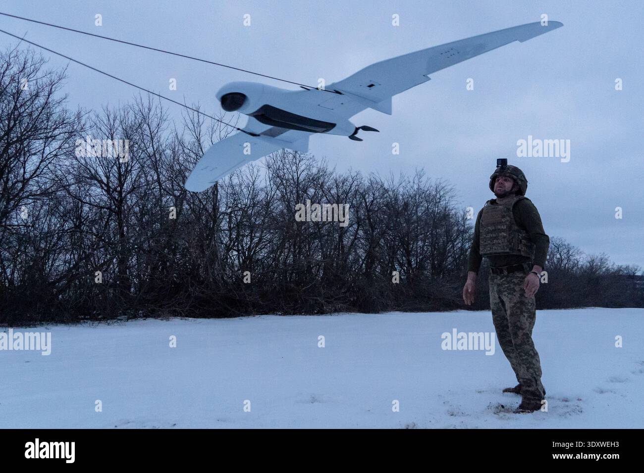 A Ukrainian soldier of the 48th separate brigade launches a ...