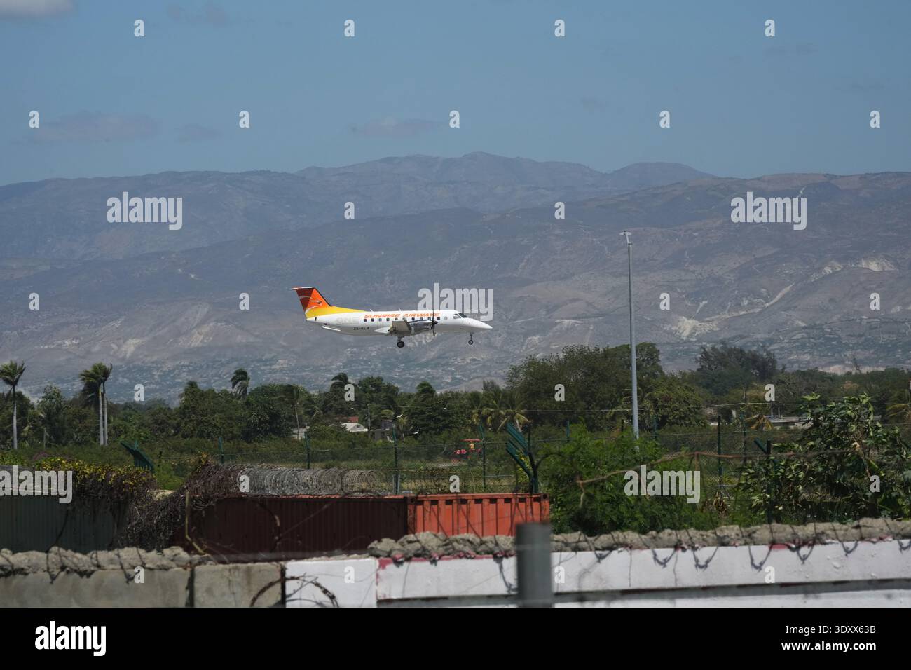A Sunrise Airways plane lands at Guy Malary Airport in Port-au-Prince ...