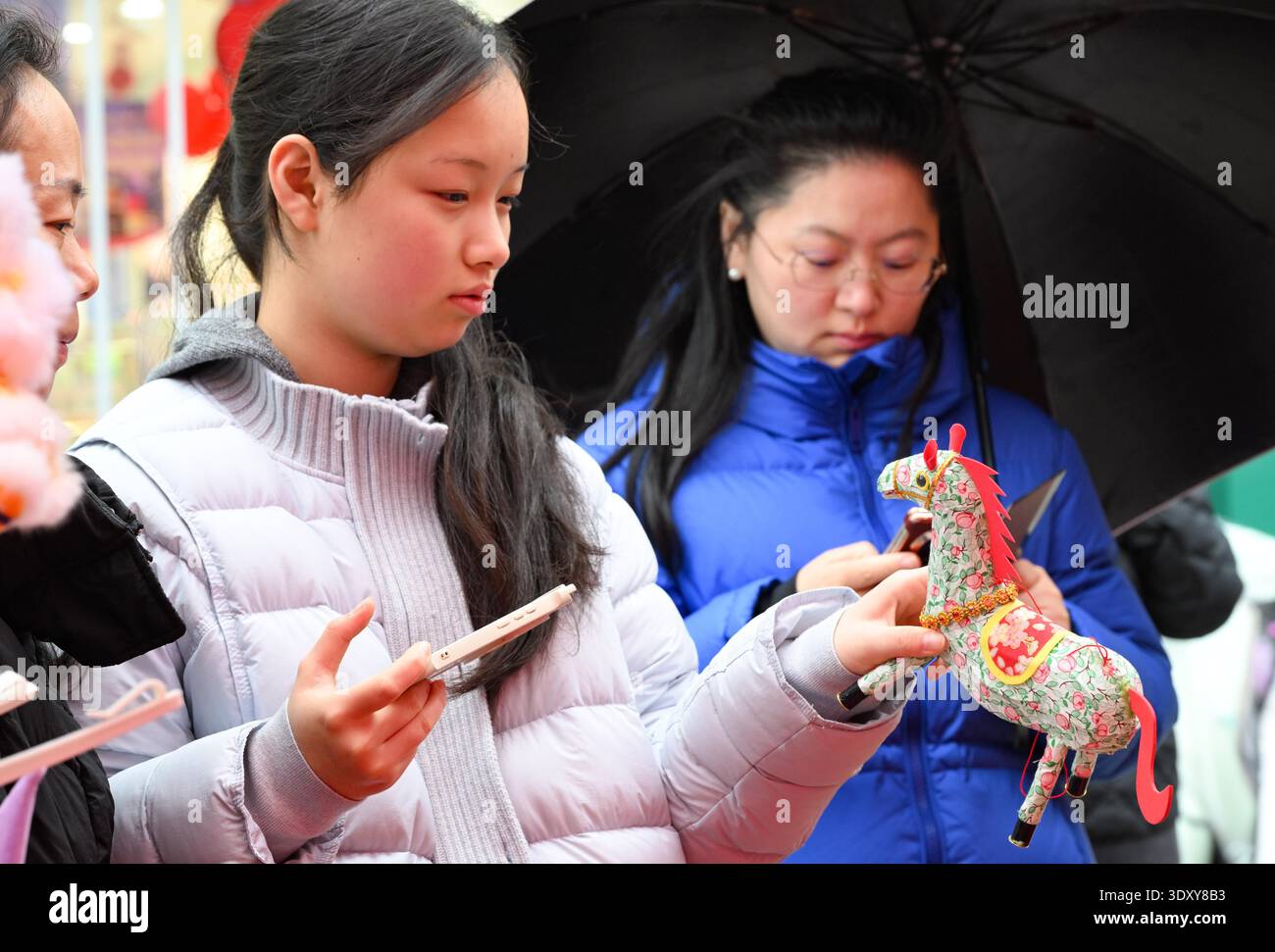 People select traditional lanterns at Confucius Temple lantern market ...
