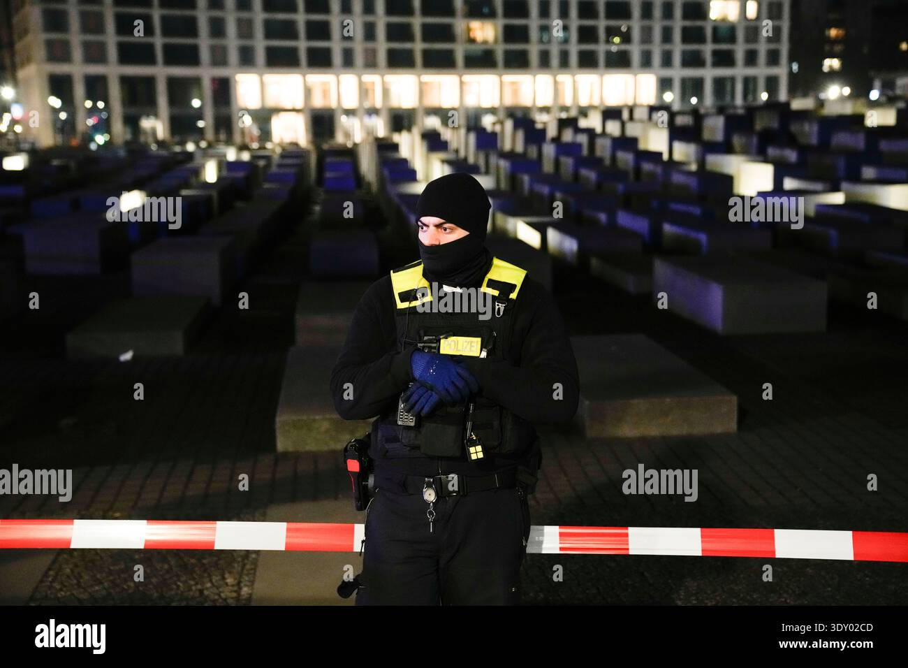 FILE -A police officer guards at the cordoned off Holocaust memorial ...