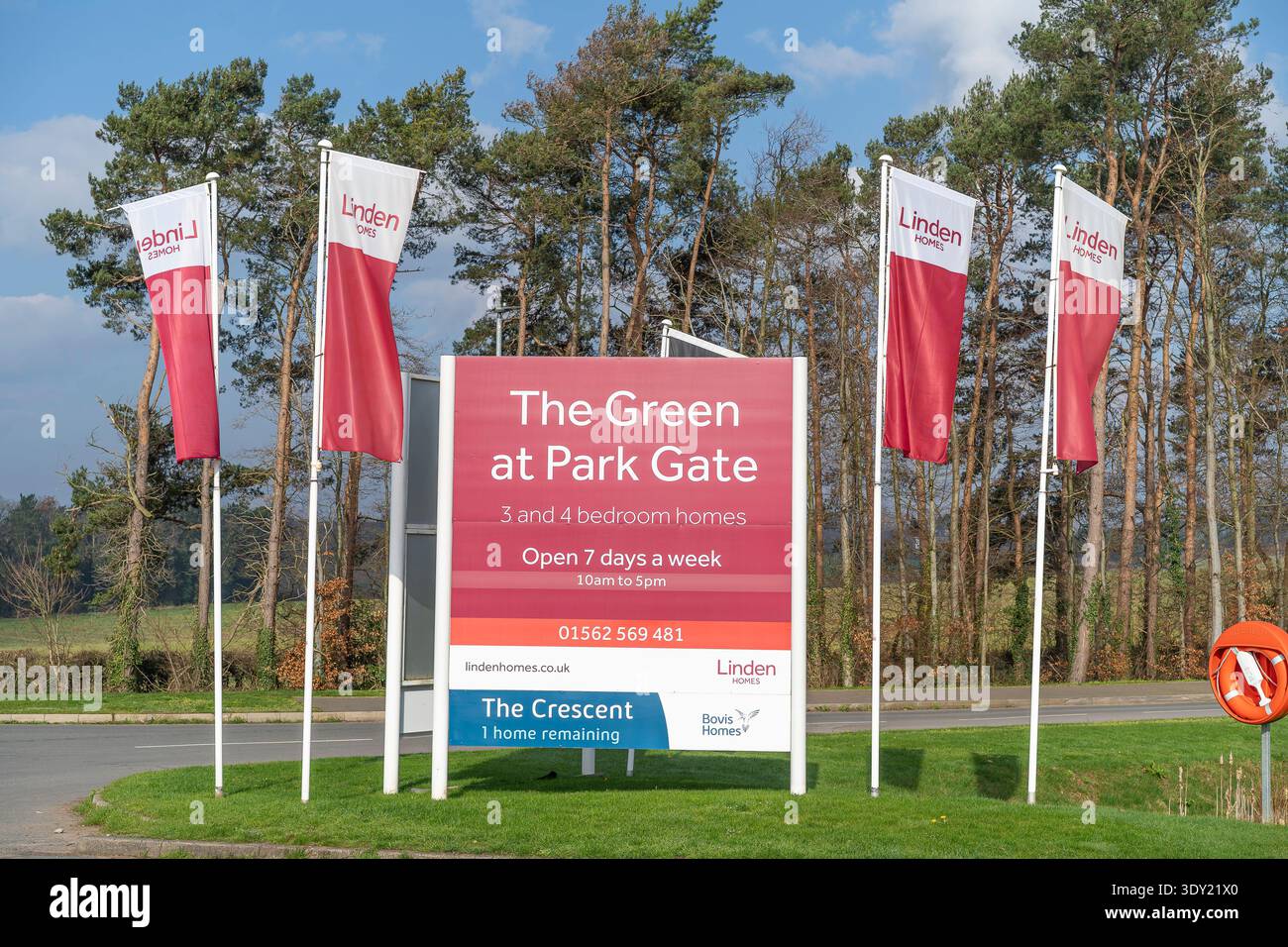 Large house building sales sign and flags by Linden and Bovis Homes at ...