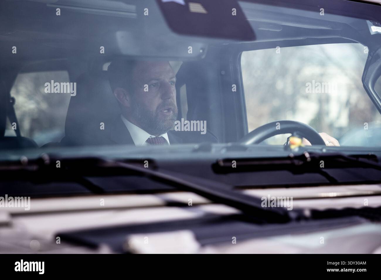 Sen. Markwayne Mullin (R-Okla.) is seen in a vehicle as he arrives for ...