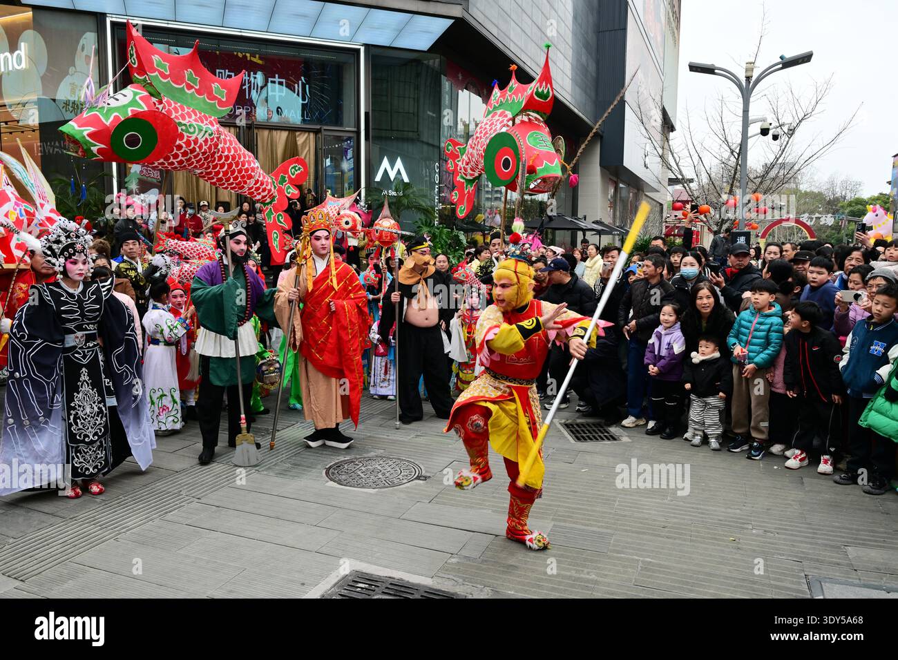 Residents watch a parade of intangible cultural heritage items in ...